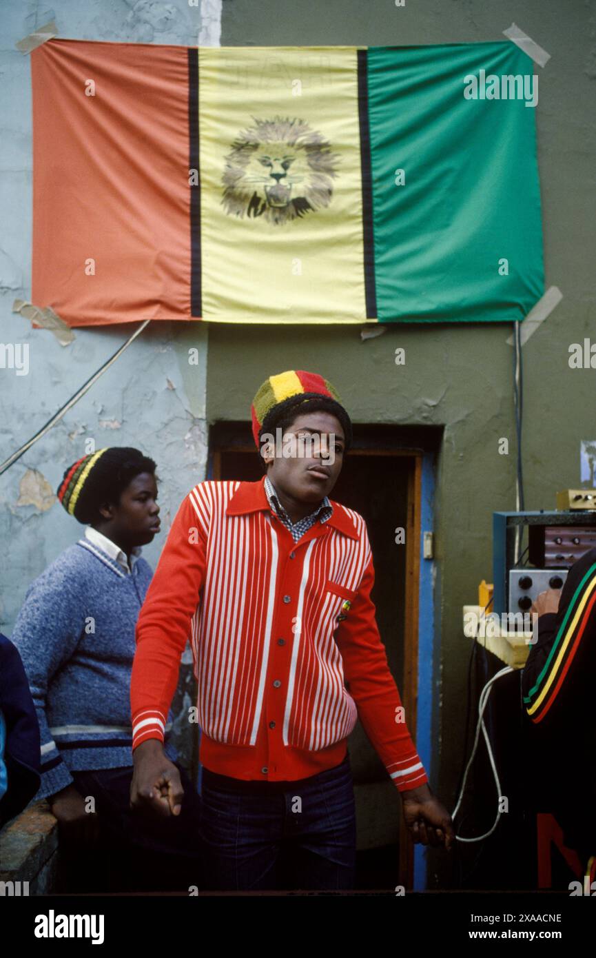 Young black 1970s British Rastafarian dancing to a sound system under a ...