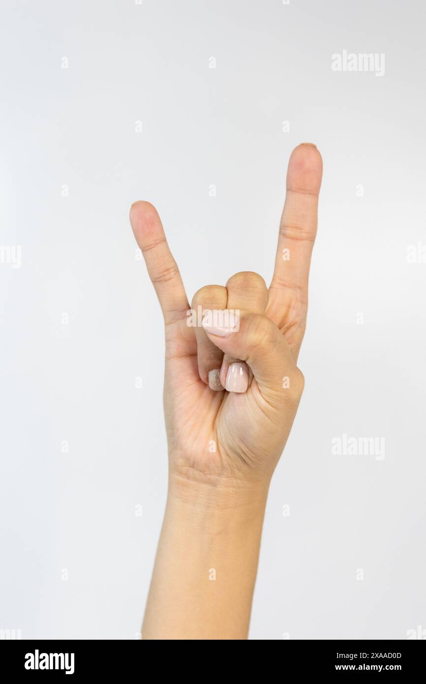 Hand Making a Rock Gesture Sign Stock Photo - Alamy