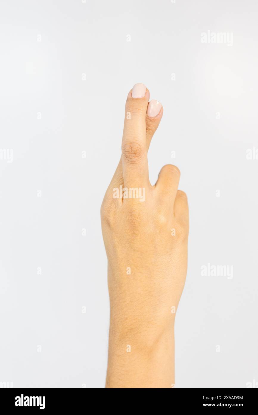 Crossed Fingers: Symbol of Hope and Luck Stock Photo - Alamy
