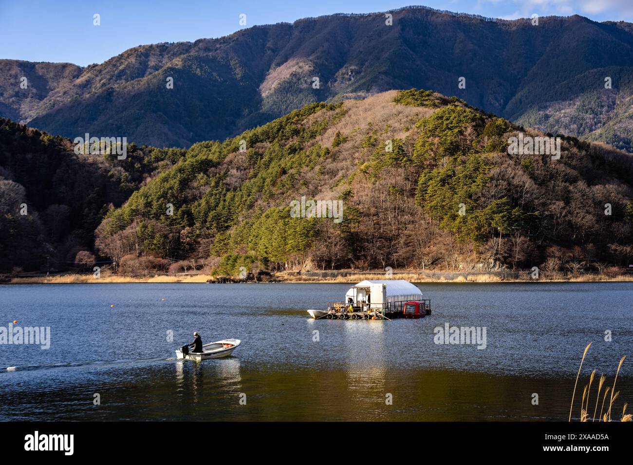 A scenic lake view in Fujikawaguchiko, Japan, featuring a boat ...