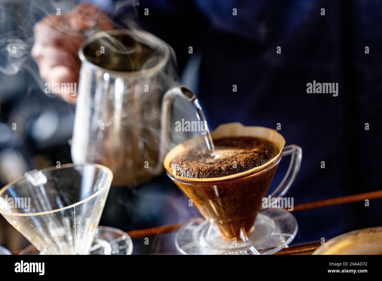 The steam rises from a pour-over coffee in a school bus cafe in ...