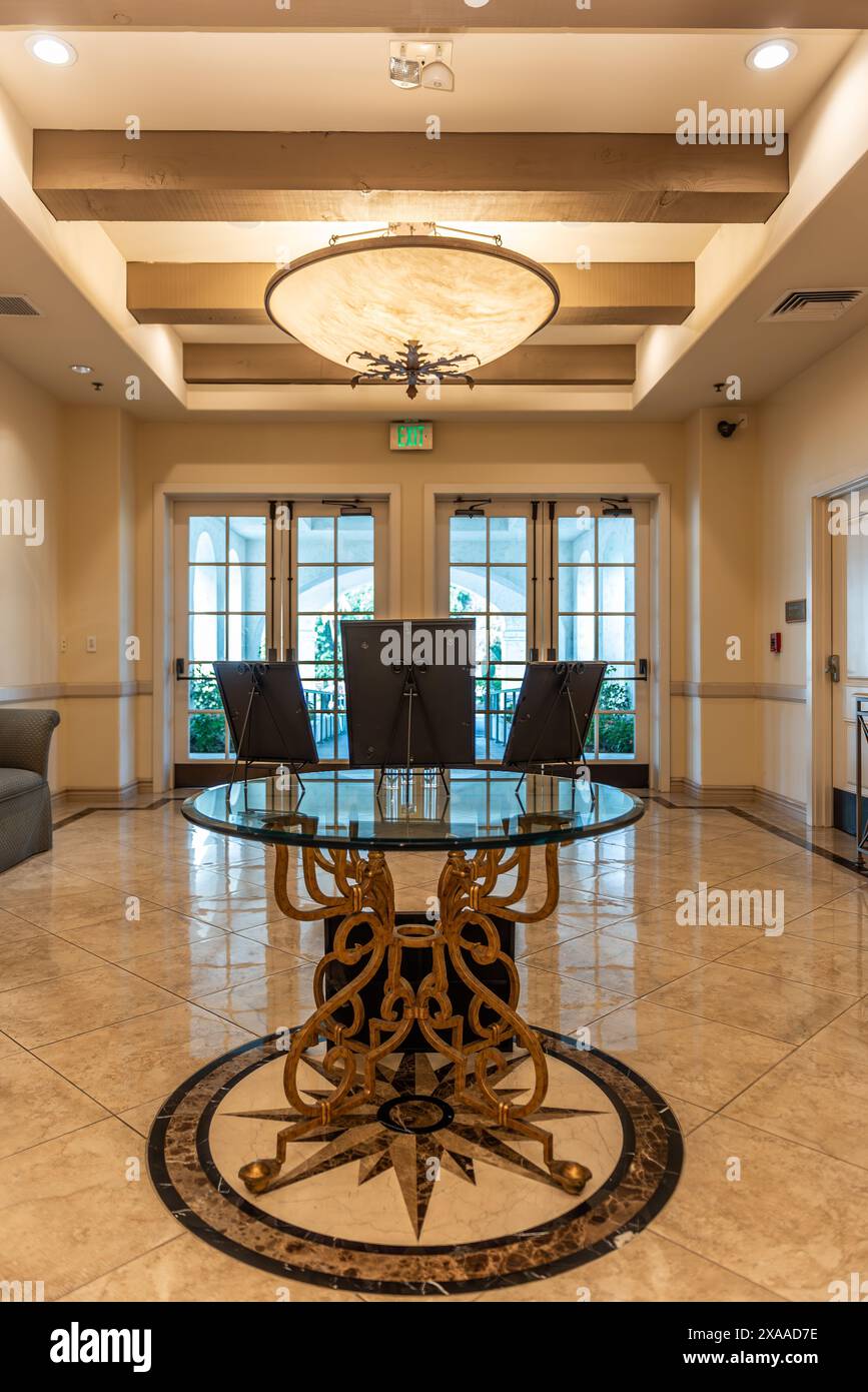 A round table with picture frames in a hotel setting Stock Photo - Alamy
