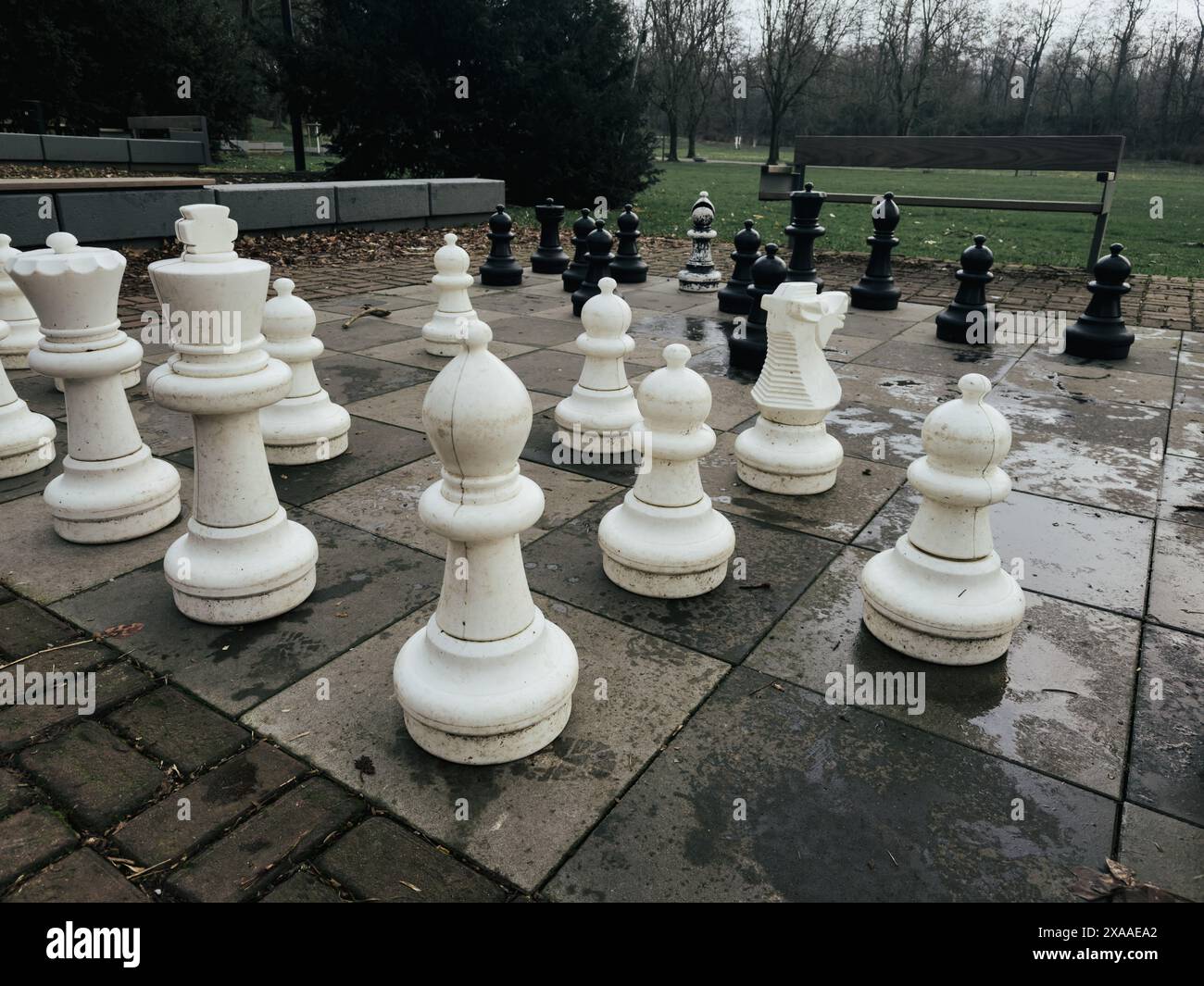 The chess pieces on a park floor, strategic game outdoors Stock Photo ...