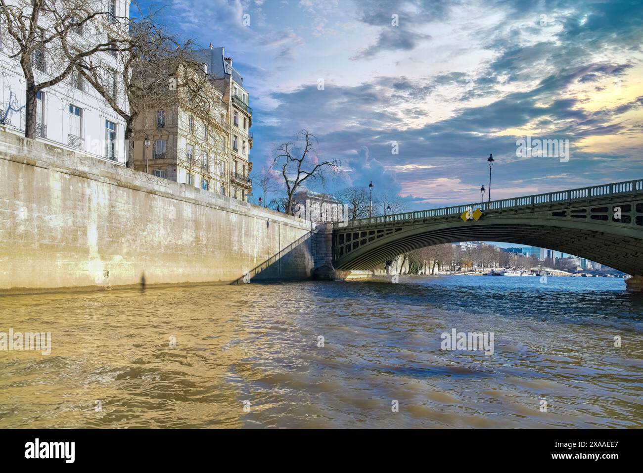 A scenic view of Saint-Louis island and beautiful Sully bridge in Paris ...
