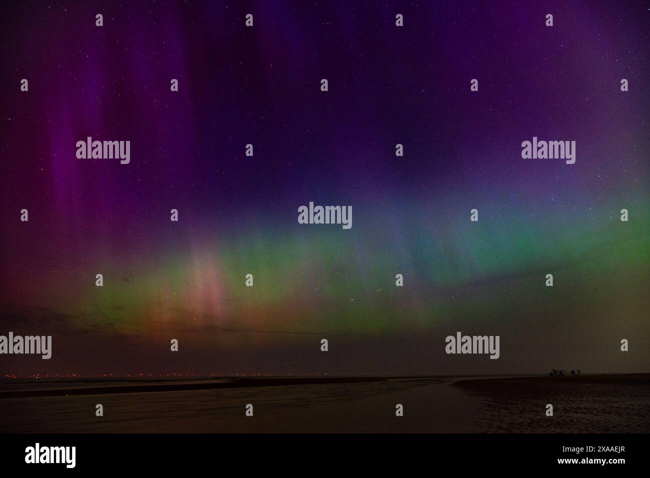 Pillars of colored aurora over the North Sea during a severe G5 solar ...