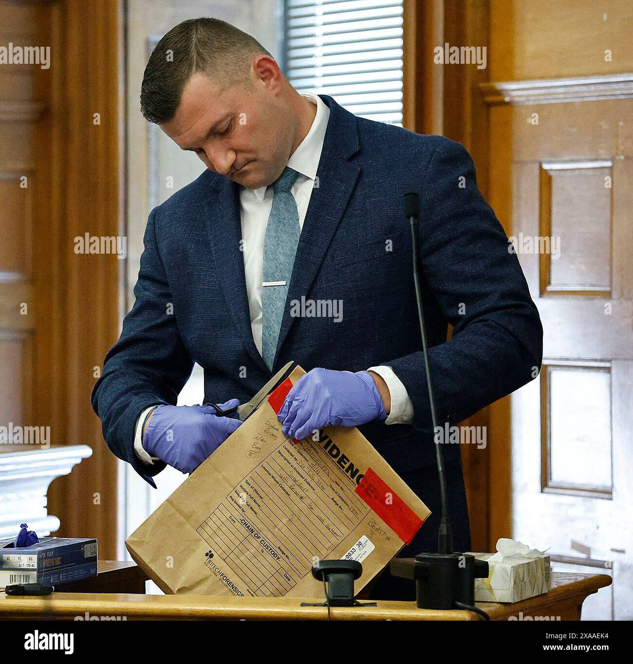 Mass. State Police detective Yuriy Bukhenik displays articles of ...