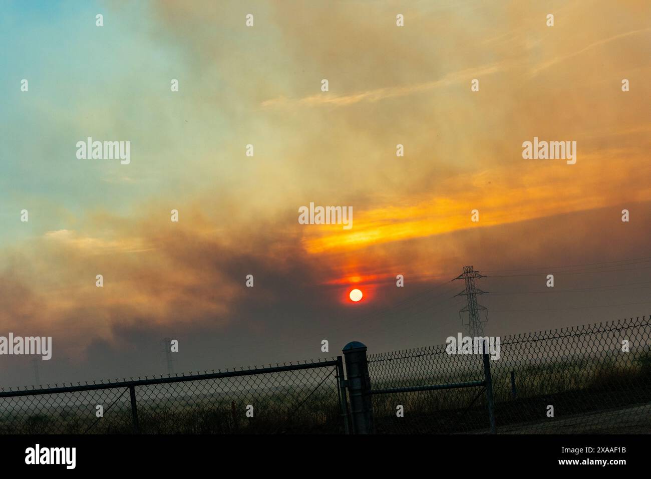 High winds from the Corral Fire in Tracy California create a wall of ...