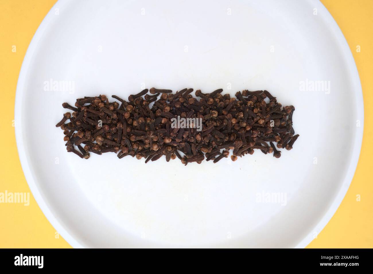 A side view of a heap of cloves, captured in a close-up shot to ...