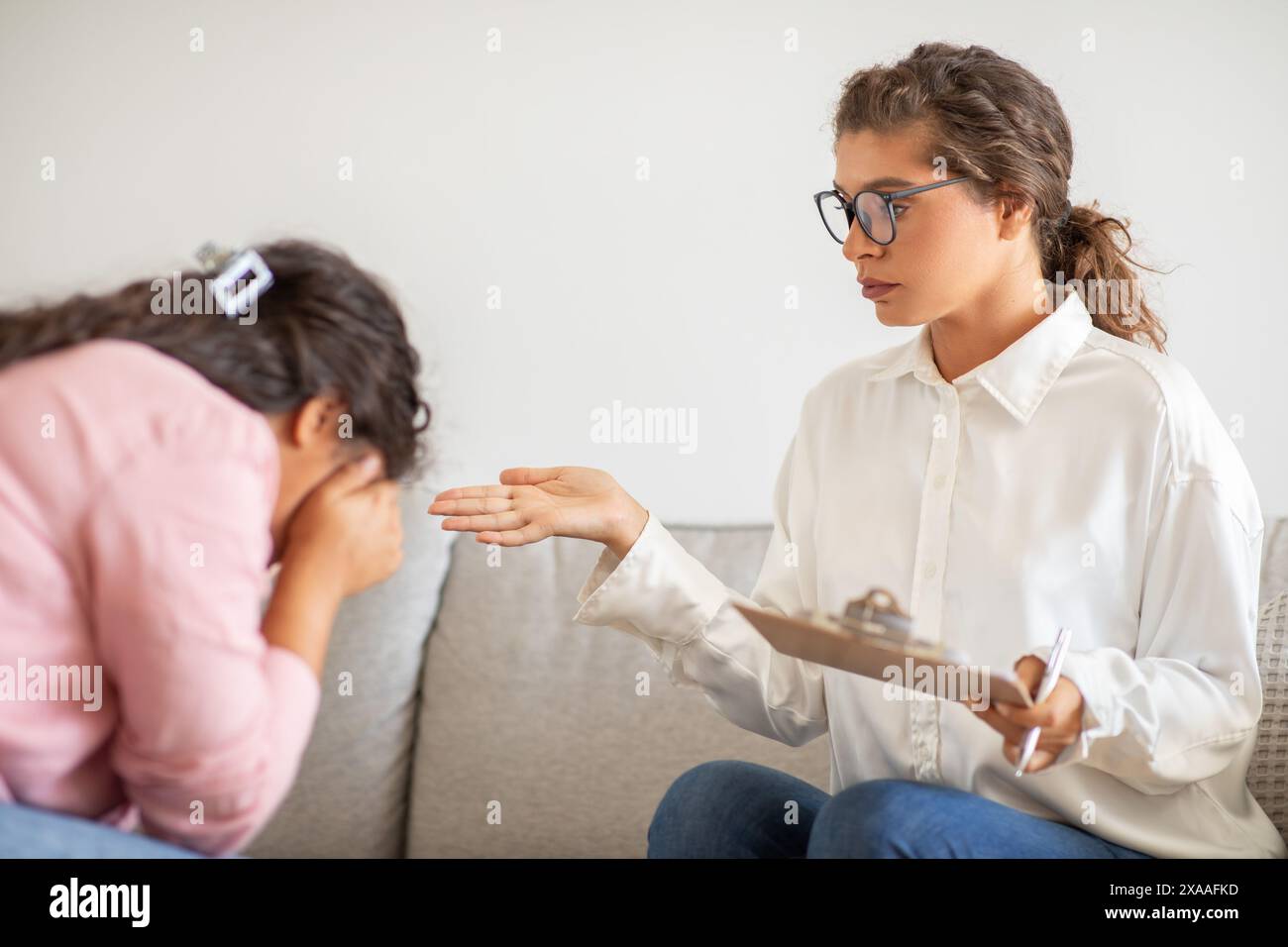 Therapist Talking to Patient During Counseling Session Stock Photo - Alamy
