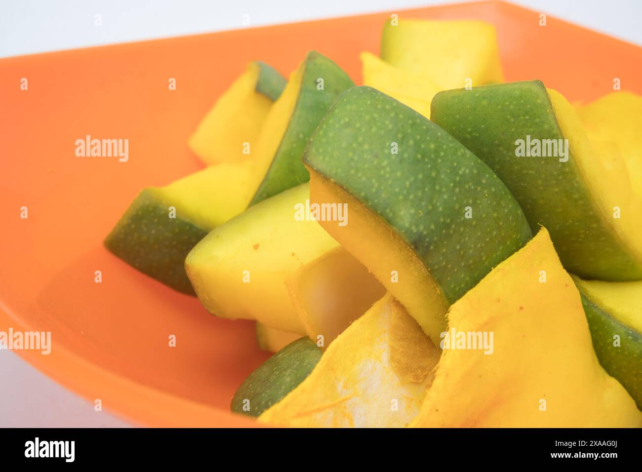 Very Close-Up View Of Slices of Mango for Mango Pickle In Saffron Color ...