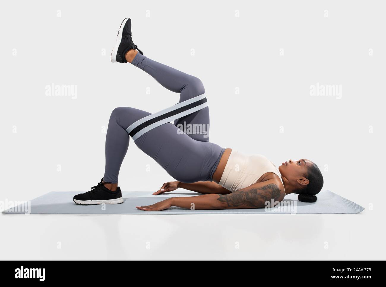 Woman glute bridge hi-res stock photography and images - Alamy