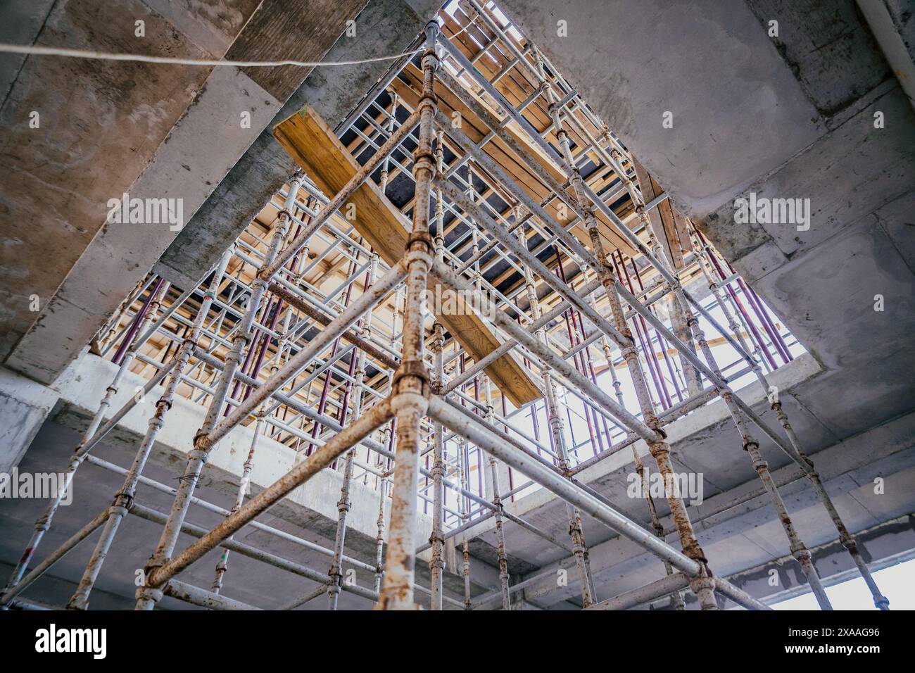 Scaffolding on a construction site is assembled in a staircase for the ...