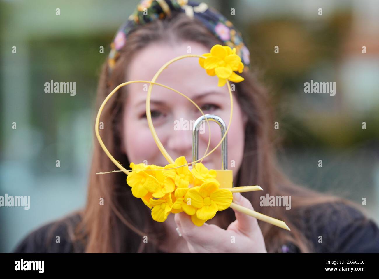 Artist Elina Sarah Tilse poses with a padlock she designed for the ...