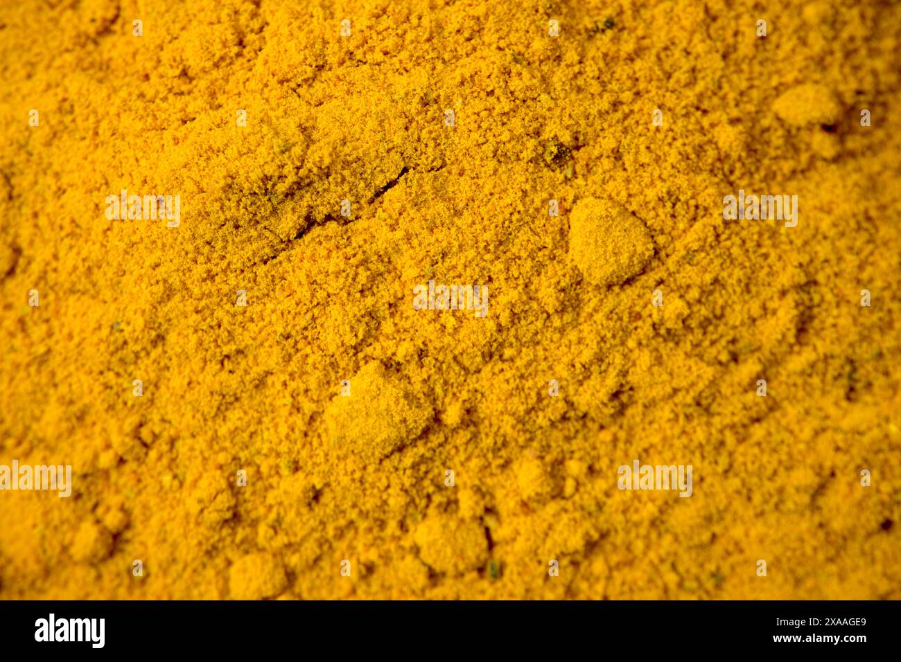 Aerial view of a pile of turmeric powder with a detailed close-up Stock ...