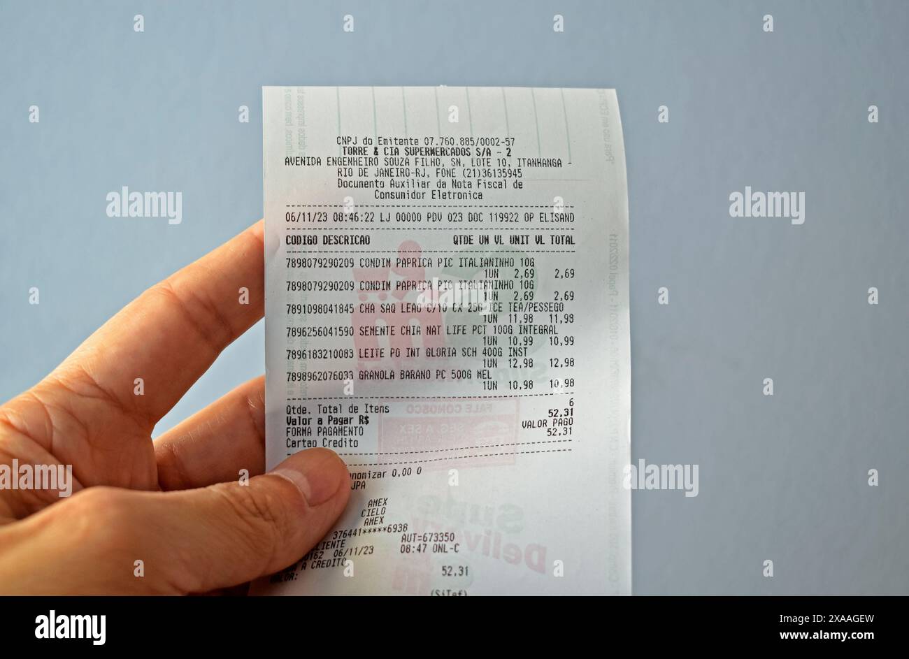 RIO DE JANEIRO, BRAZIL - NOVEMBER 10, 2023: Supermarket receipt on hand ...