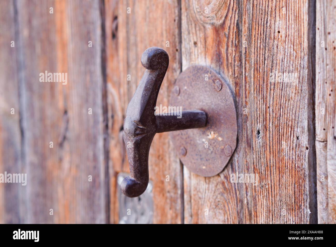 rusty antique iron door handle on wooden door Stock Photo - Alamy