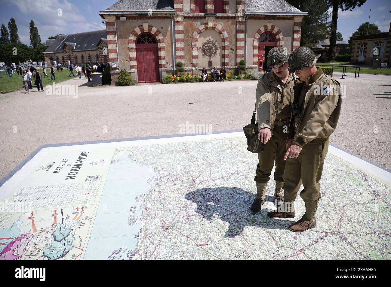 WW II enthusiasts look at the D-Day landing map, ahead of celebrations ...