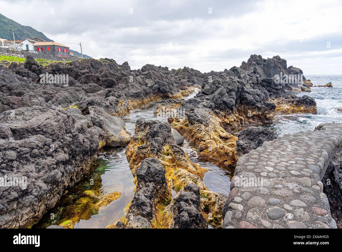 Characteristic volcanic formations next to the sea forming natural ...