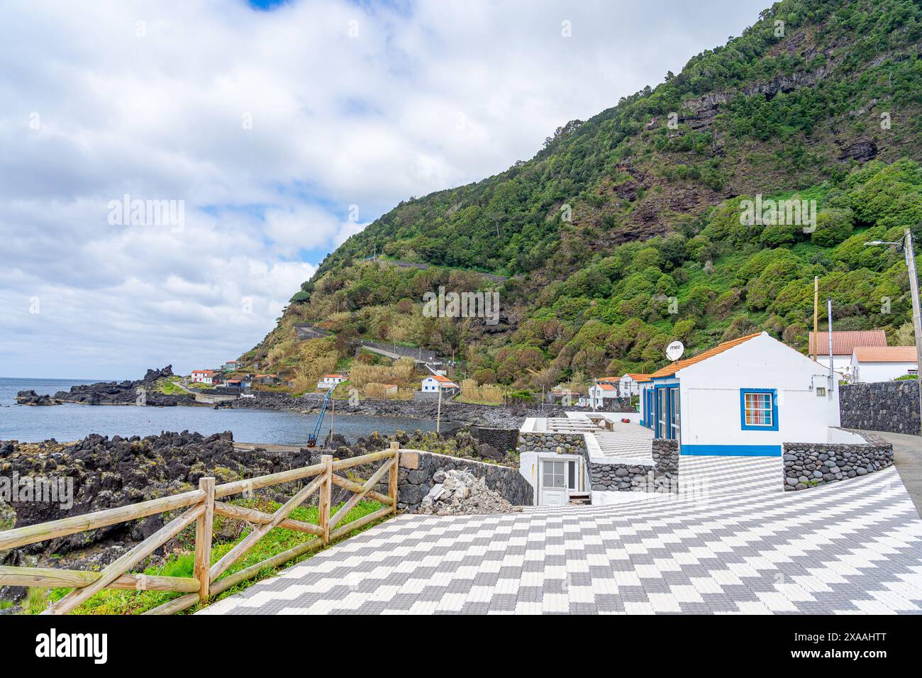Typical residential houses in Fajã das Almas next to the sea. São Jorge ...