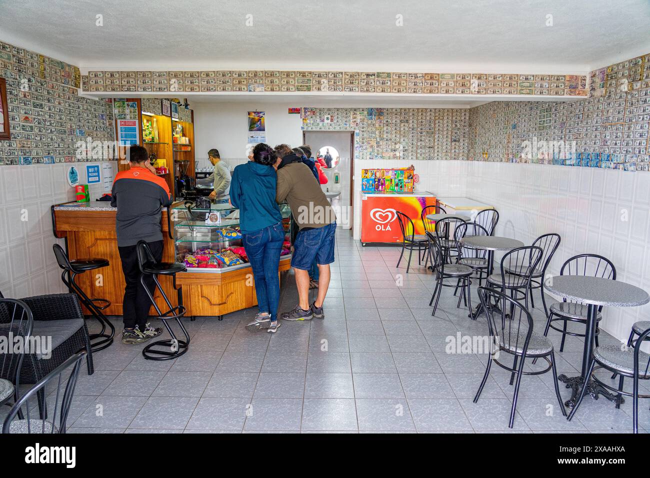 Interior of the Nunes café with customers standing and drinking coffee ...