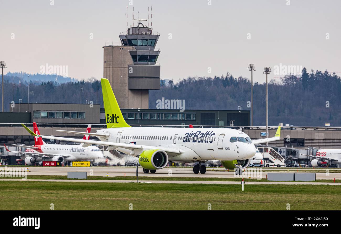 An Air Baltic Airbus A220-300 taxis to the runway at Zurich Airport ...