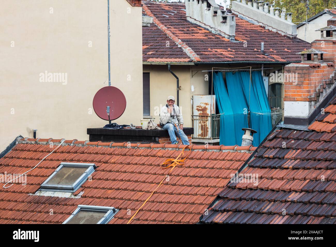Turin, Italy - October 8, 2019: Antenna fitter smoking a cigarette ...