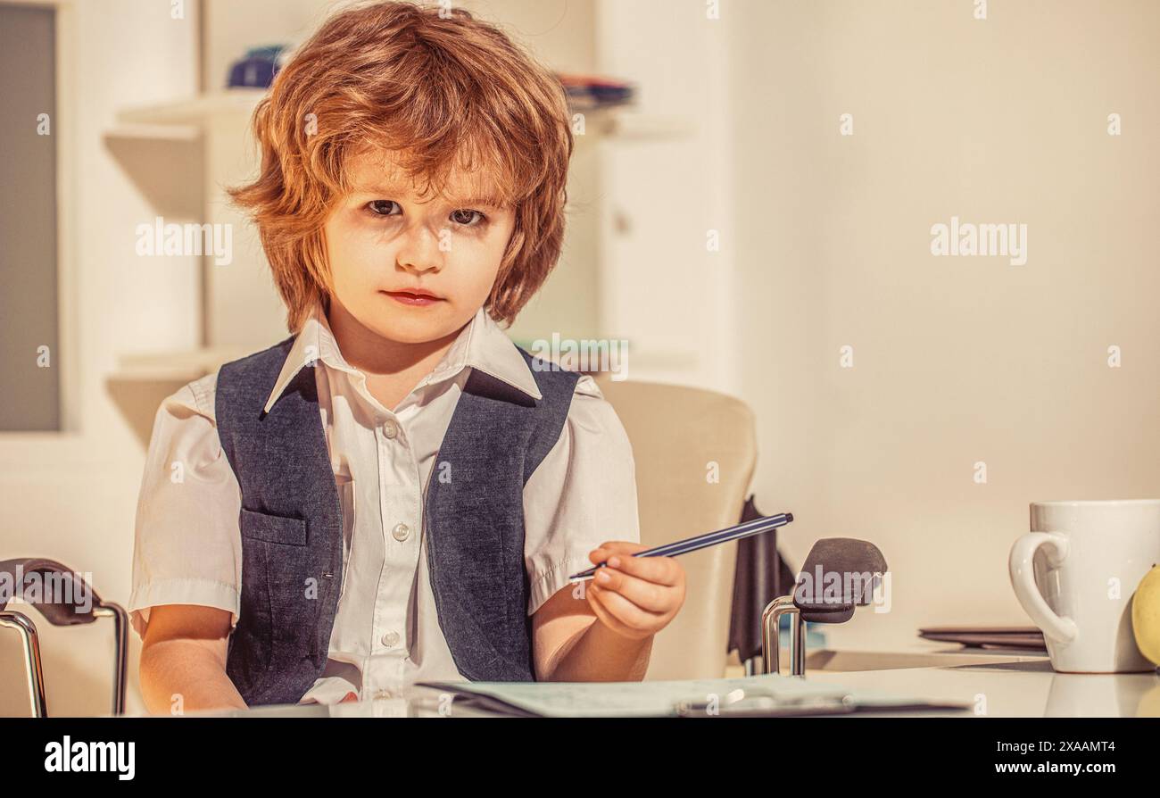 Young business boy. Little boss in office. Young businessman using a ...