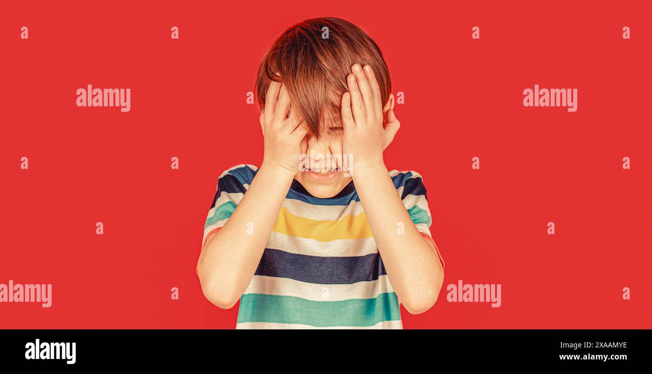 Little boy having headache. Portrait of a little boy holding her head ...
