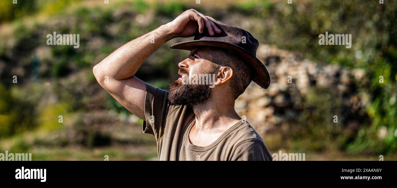 Cowboy Hat. Portrait of young man wearing cowboy hat. Cowboys in hat ...