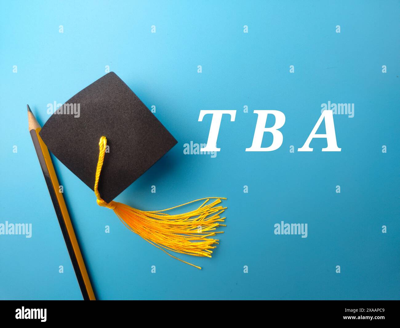 Pencil and graduation hat with the word TBA To Be Announced on a blue ...