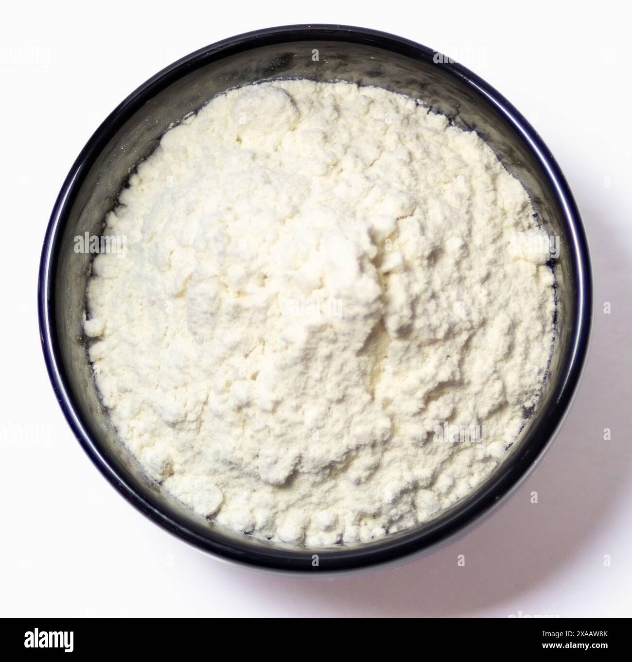 Black container with refined white flour inside. White background Stock ...