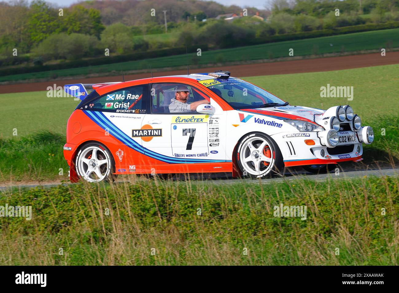 A Ford Focus with Martini livery seen heading along a country road to ...
