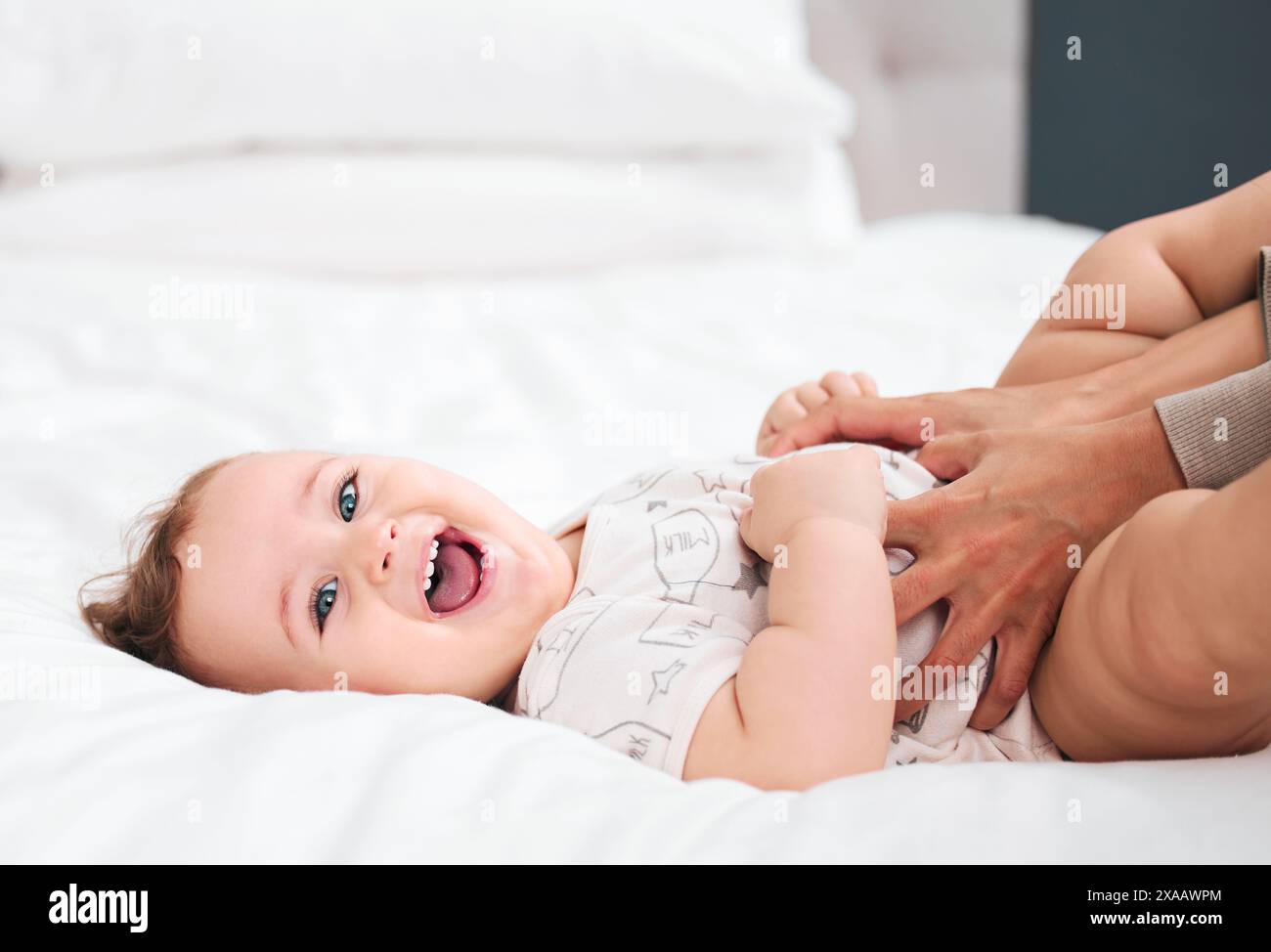 Love, portrait and happy baby with mother on a bed for fun, bonding and ...