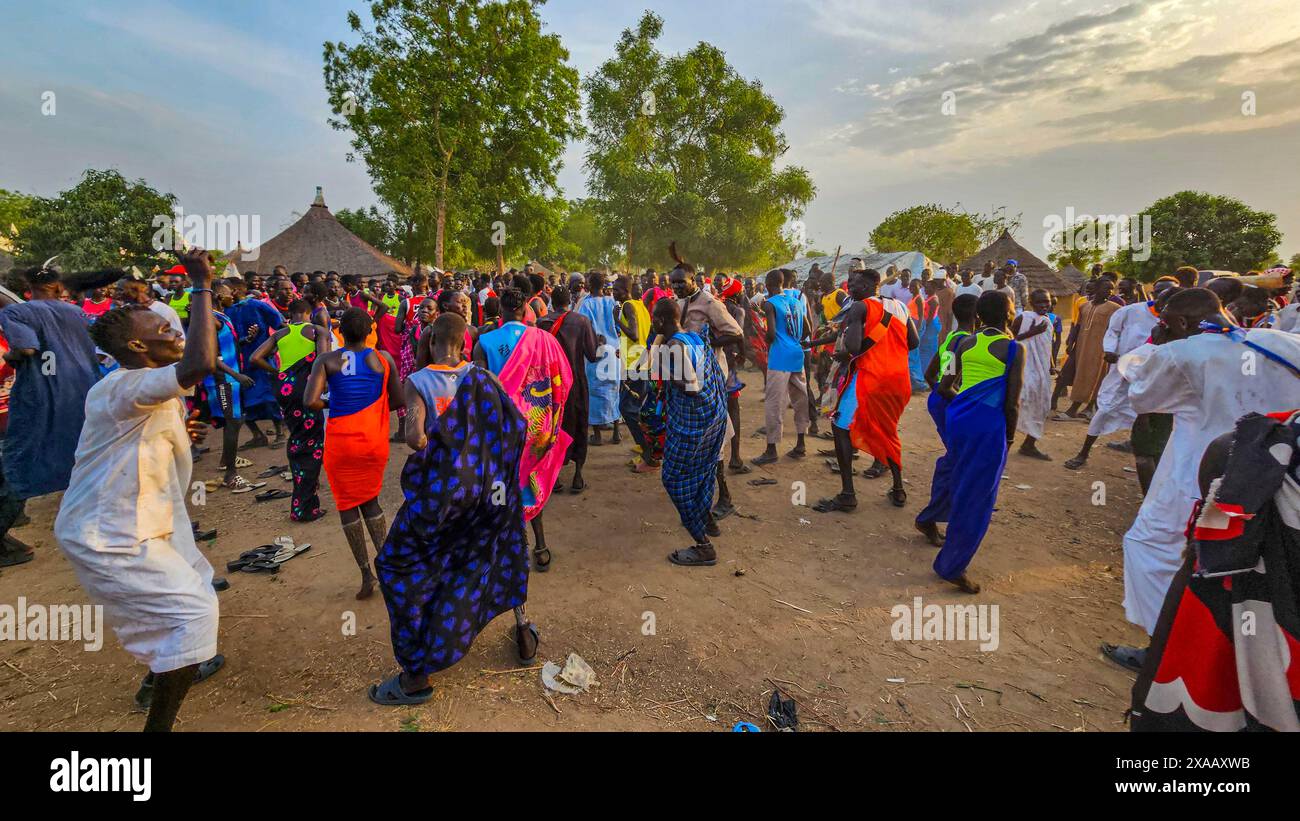 Locals dancing at a traditional Dinka wedding, Bor, central region ...