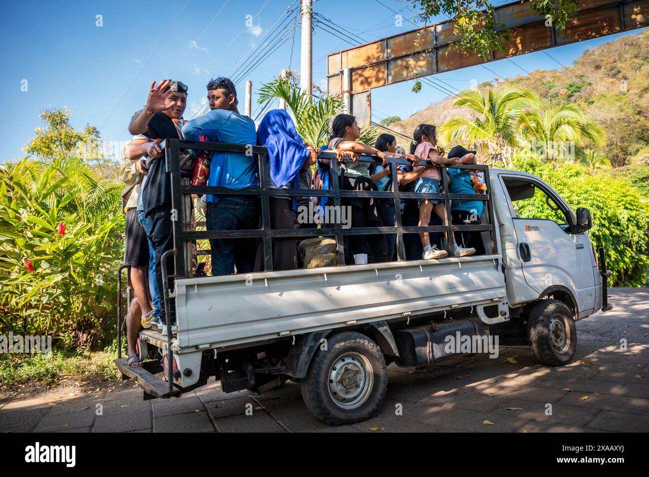 Local transport - people standing crammed on a back of a truck, El ...