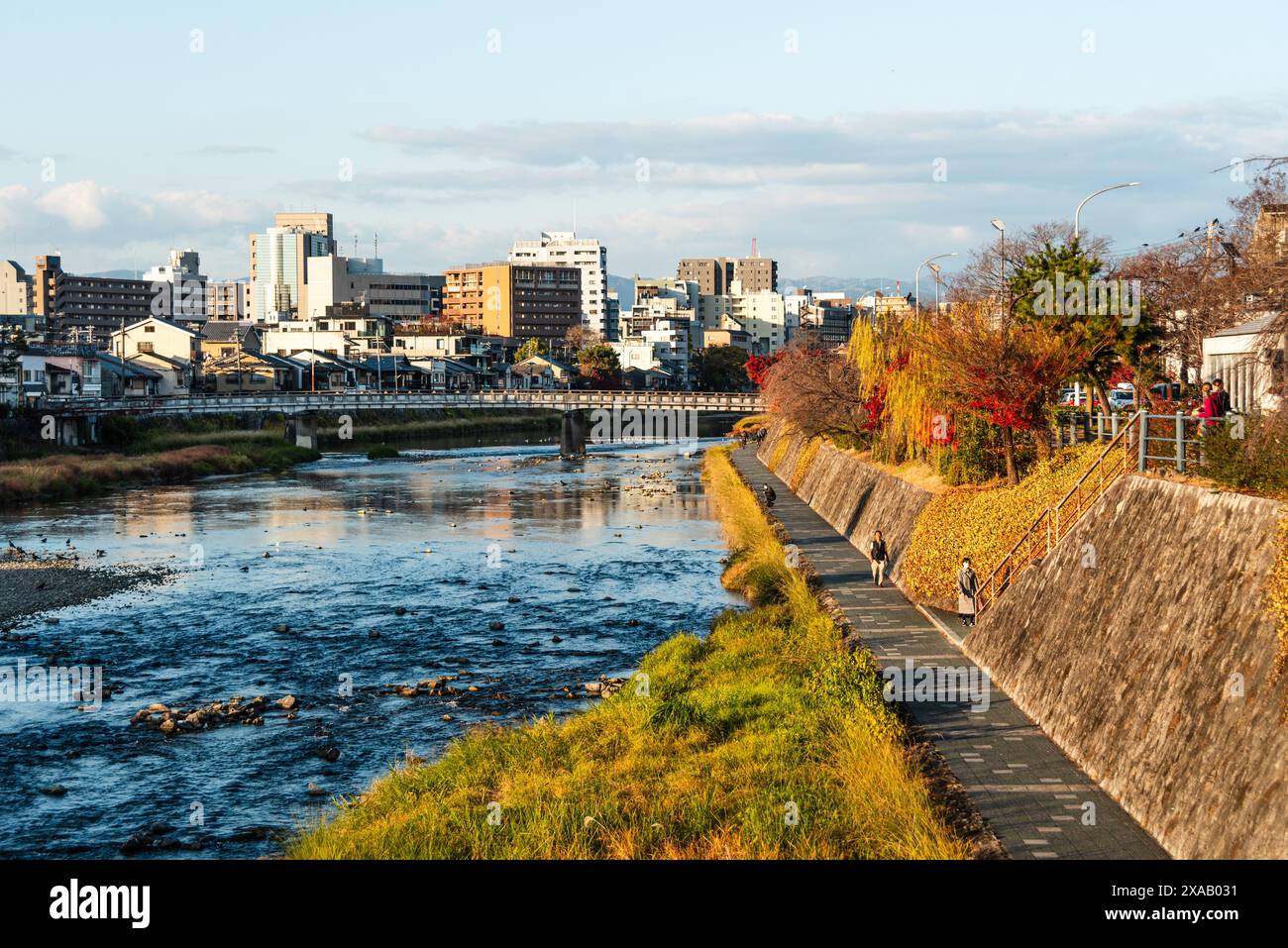 Sunset in Kyoto above the Kamo River walk and city skyline, Kyoto ...