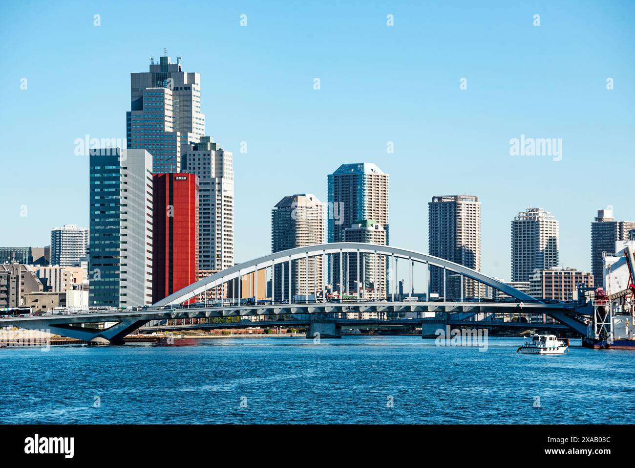 Arched bridges over the Sumida river and blue sky day with skyscrapers ...