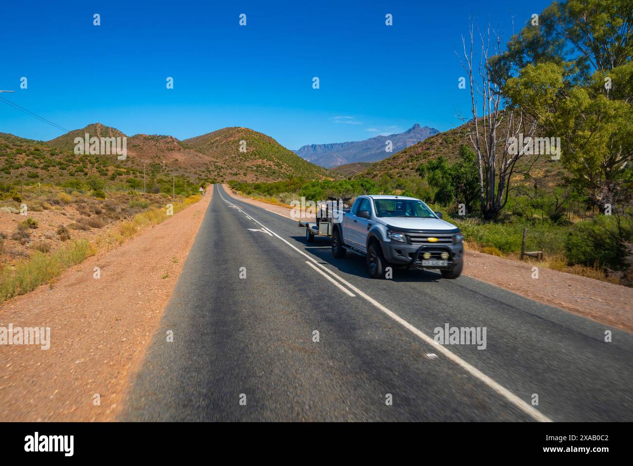 View of road R62 and green mountainous landscape between Zoar and ...