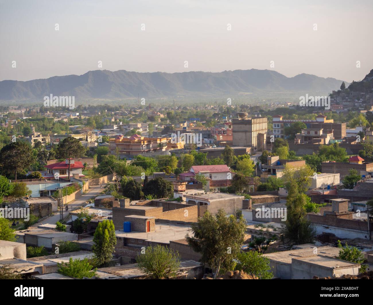 Scenic panoramic view of a small town nestled near mountains in ...