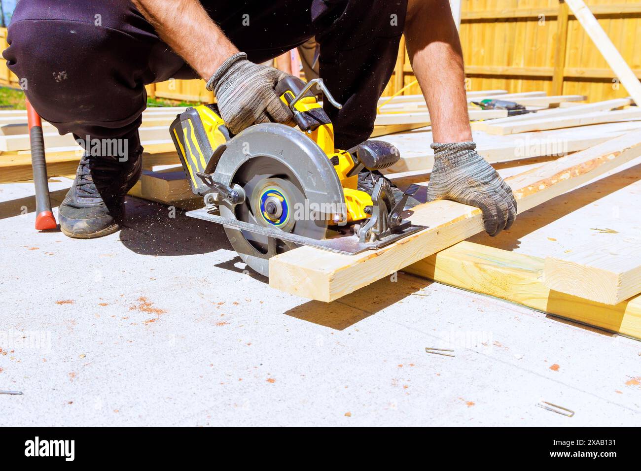 Cutting of wood beams is performed with an electrically powered ...