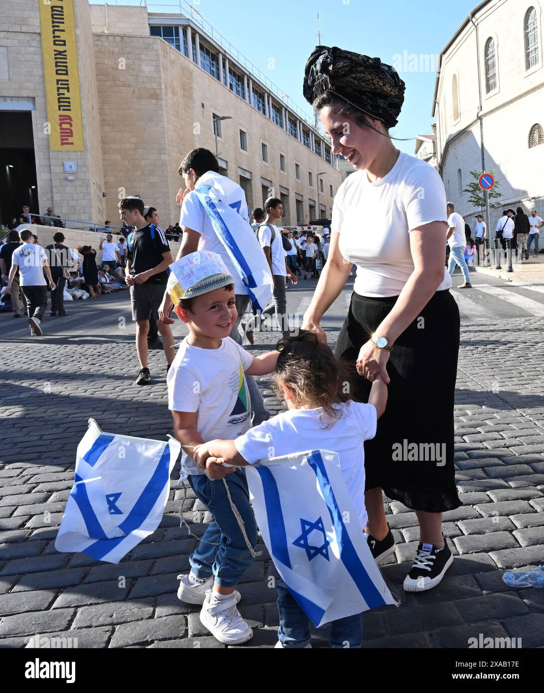 Jerusalem, Israel. 05th June, 2024. A woman dances with her children ...