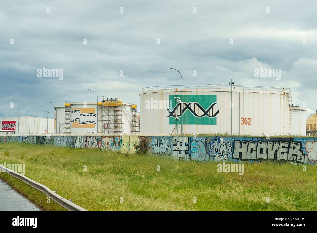 Lyon, France - May 7, 2023: Industrial oil tanks with murals and ...