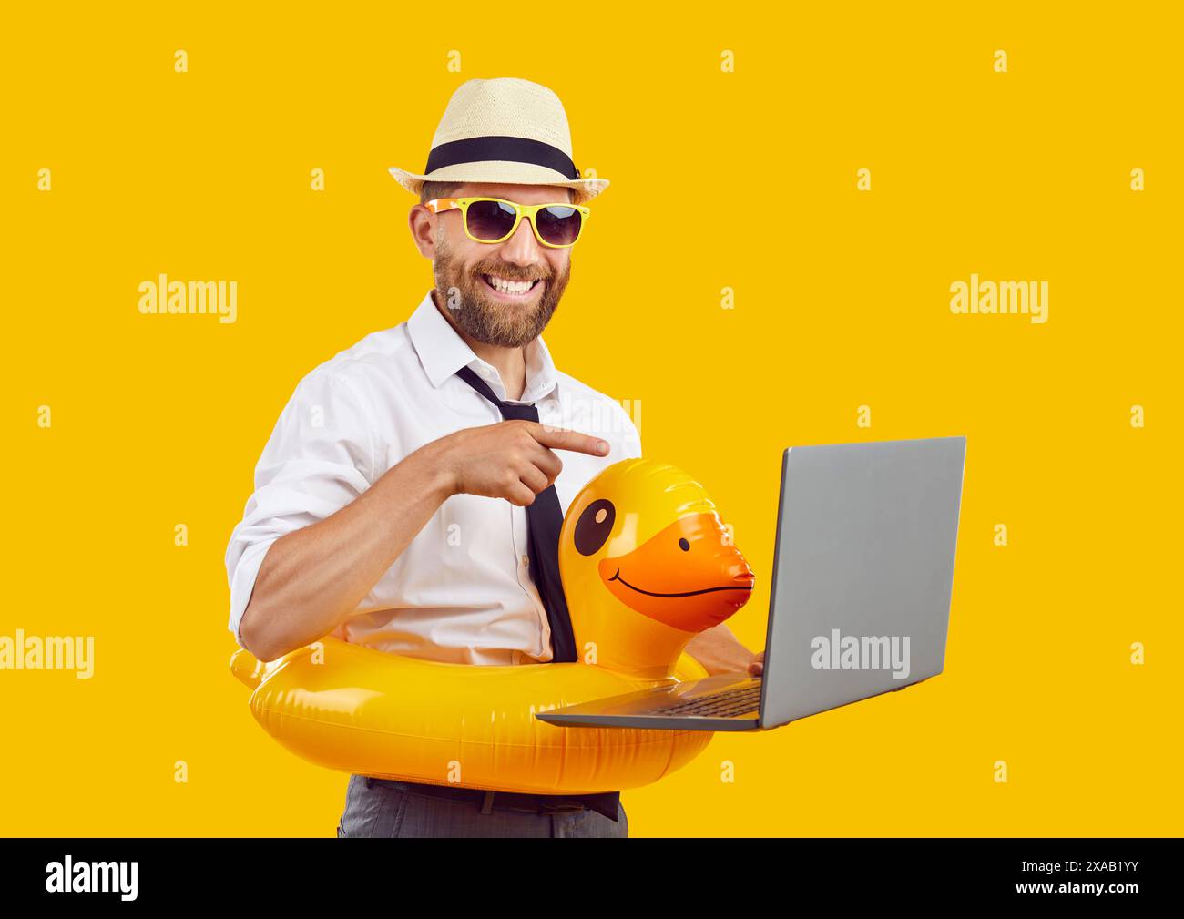 Happy funny businessman is working on laptop computer during his summer ...