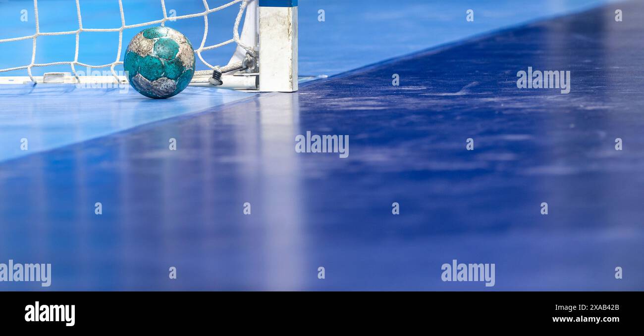 Gate and ball for futsal or handball in gym. Detail of gate frame and ...