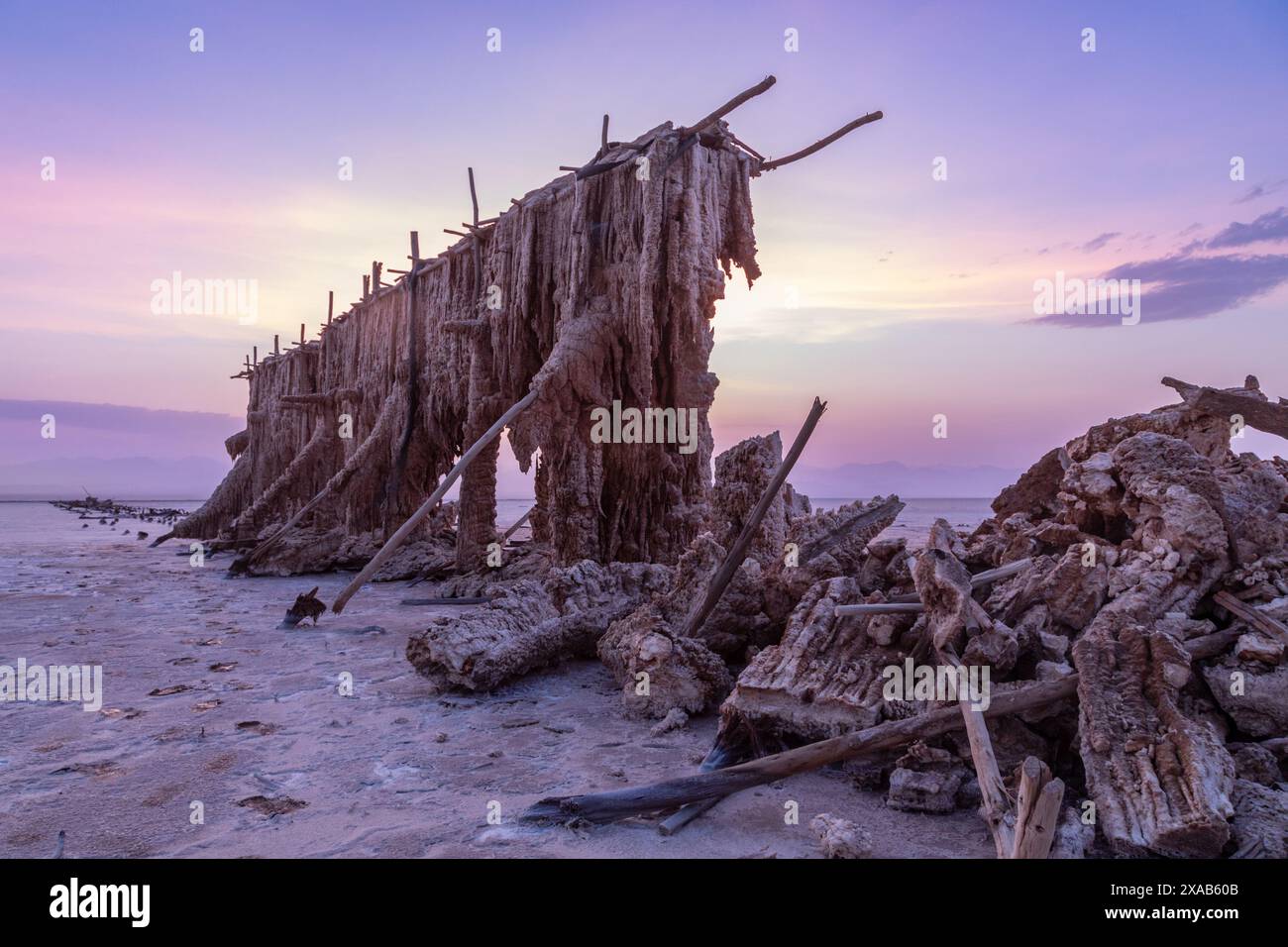 Ruins of salt mines bridge on Karum white salt lake surface, Danakil ...