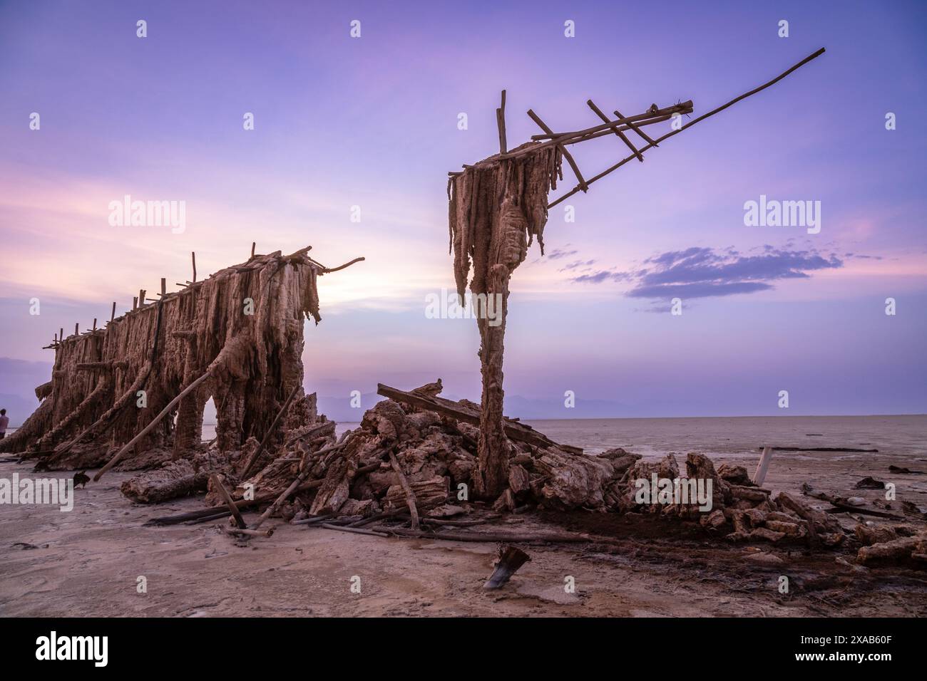 Ruins of salt mines bridge on Karum white salt lake surface, Danakil ...