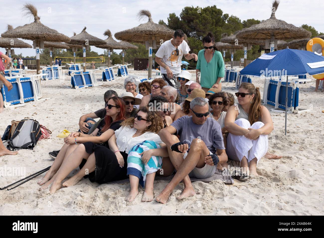 Spanish protesters at Sa Rapita beach simulating a packed beach ...