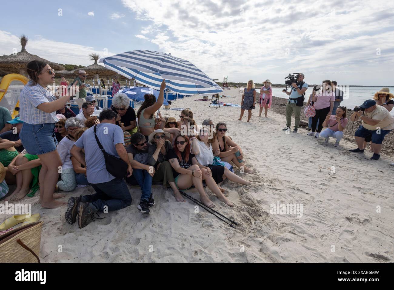 Spanish protesters at Sa Rapita beach simulating a packed beach ...