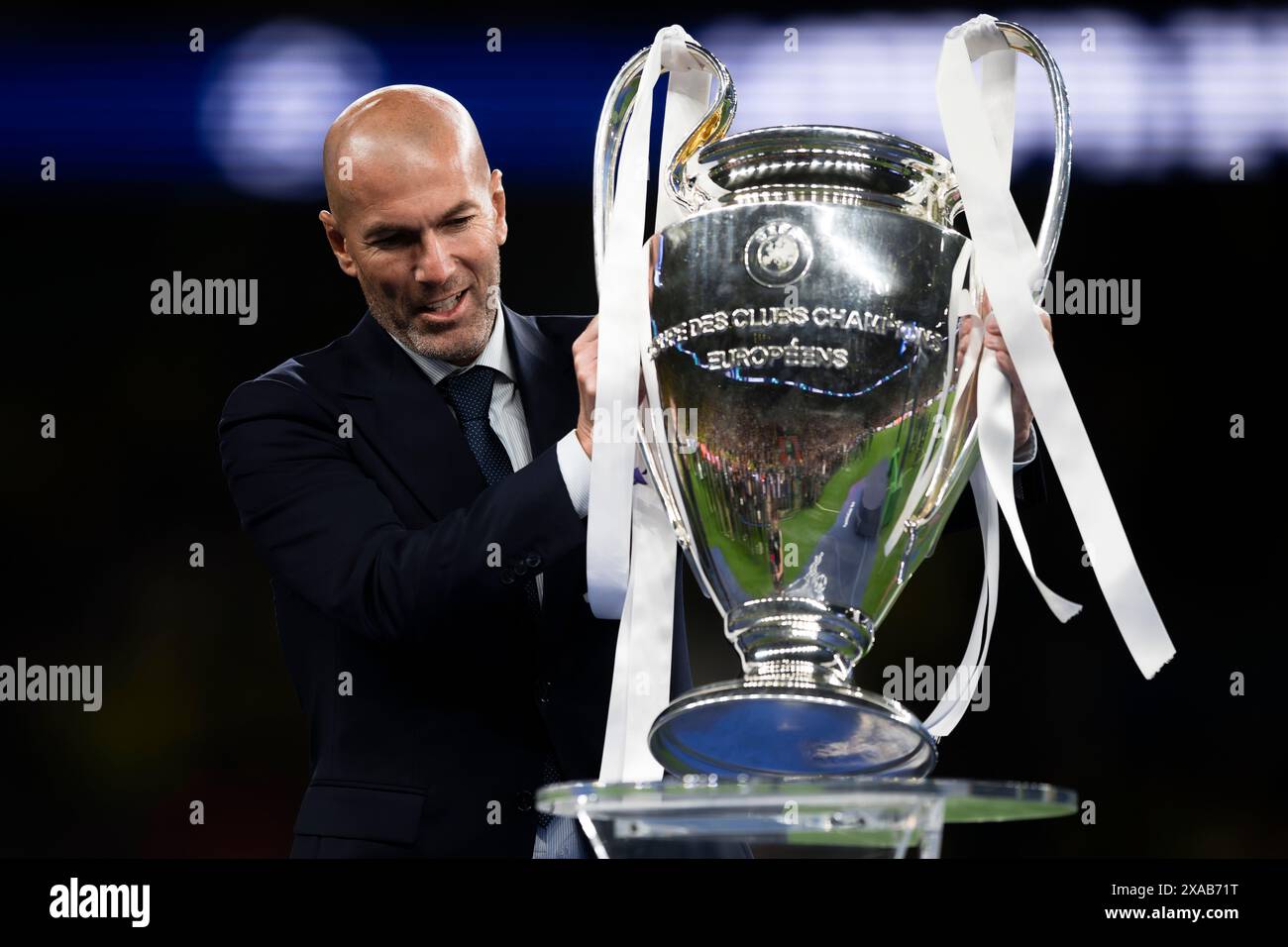 London, United Kingdom. 1 June 2024. Zinedine Zidane holds the trophy ...