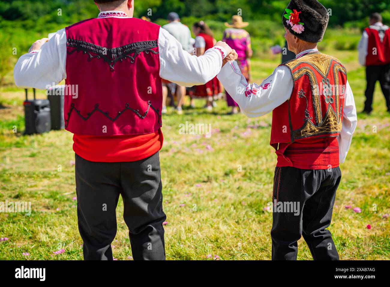 Men in traditional Bulgarian ethnic costumes with folklore embroidery ...